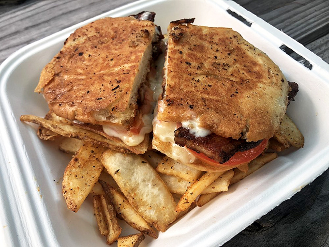 This sandwich doesn't just satisfy hunger &ndash; it solves problems. Golden-crisp exterior, melty interior, and flat fries that double as edible utensils.