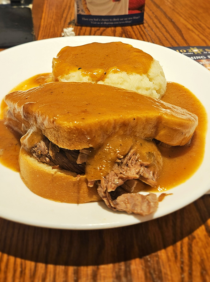 The legendary pot roast sandwich&mdash;tender beef surrendering to gravity between bread slices, swimming in gravy that could make cardboard taste like a delicacy.