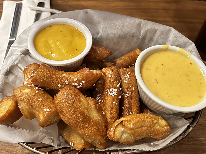 These pretzel nuggets aren't just appetizers; they're golden-brown ambassadors of joy, served with dipping sauces that demand to be sampled equally.