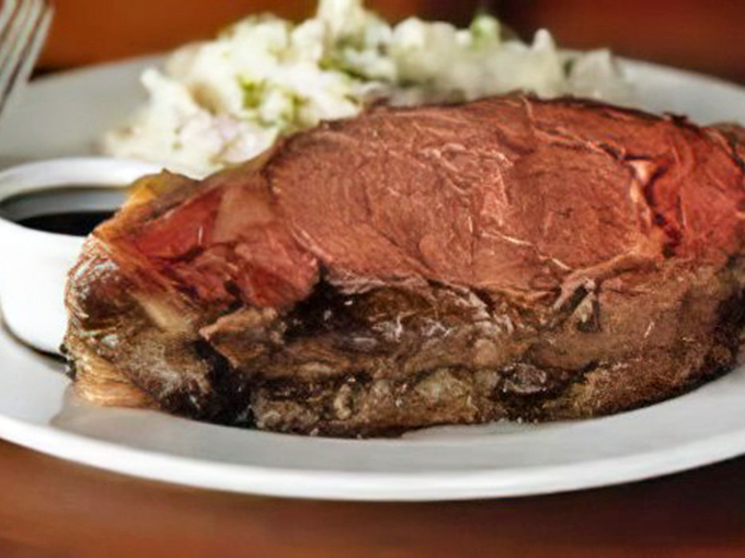 Behold the star of the show – prime rib so perfect it belongs in a steakhouse hall of fame.