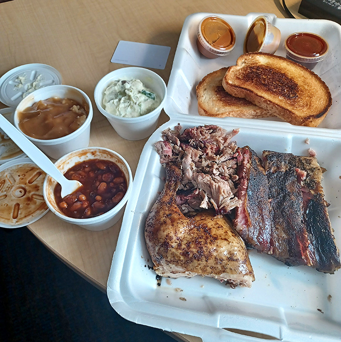 BBQ platter perfection: smoky meats, toast, and sides that don't know they're supposed to be supporting actors. The beans alone deserve their own fan club.