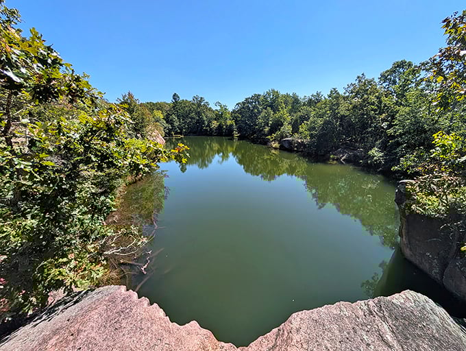 This serene quarry lake, carved by human hands but reclaimed by nature, offers a mirror-perfect reflection of Missouri's brilliant blue skies.