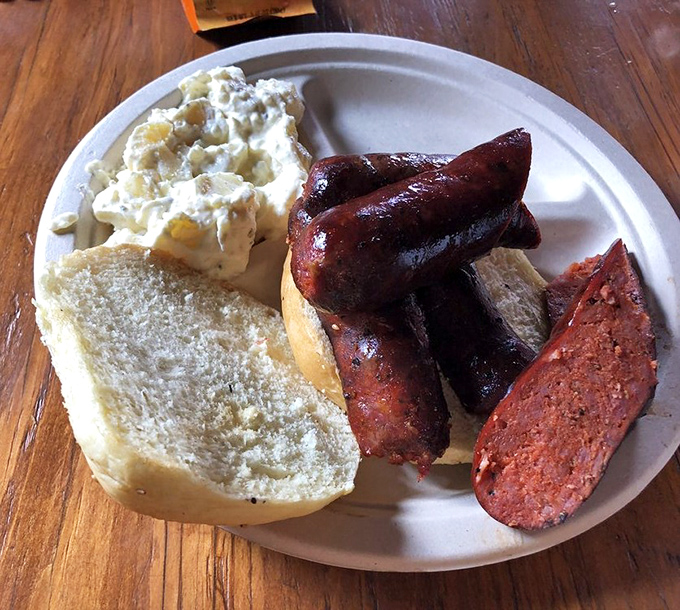 Sausage sandwich that snaps with each bite, potato salad that grandma would approve of, and bread that knows its supporting role.