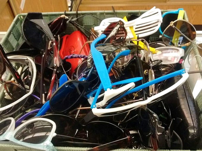 The sunglasses bin: where designer knockoffs and authentic vintage pieces mingle democratically in plastic harmony.