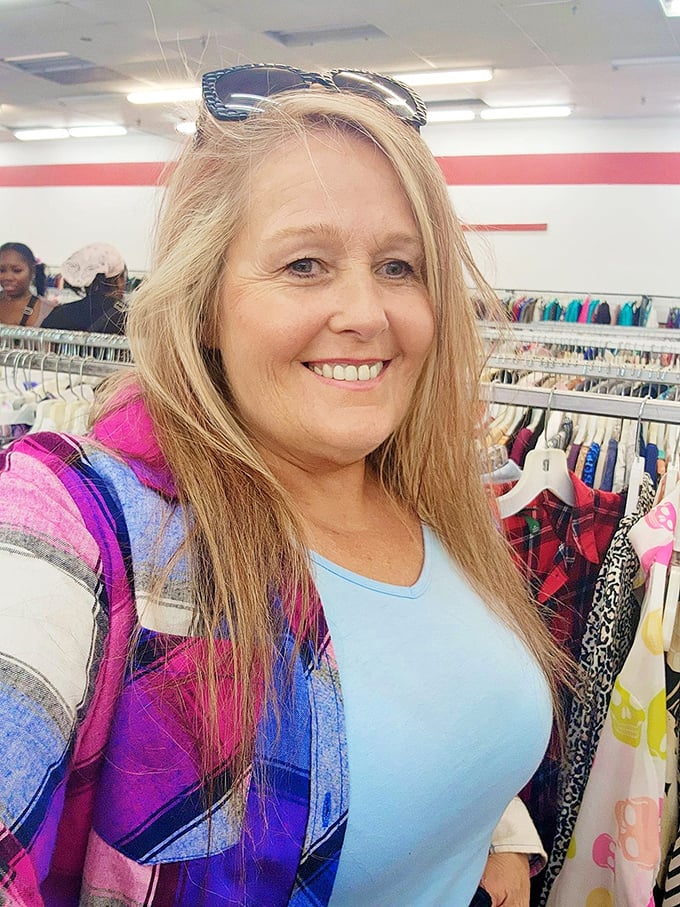 The true thrill of thrifting comes alive here, where shoppers navigate a sea of possibilities with practiced determination.