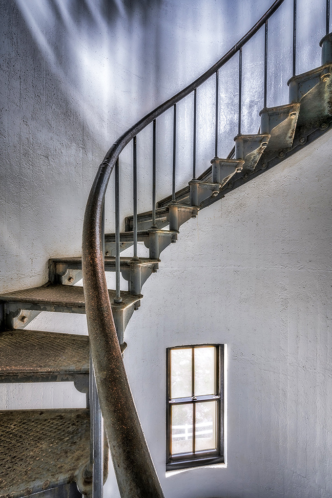 Spiral staircases: where function meets beauty. These metal steps have carried lighthouse keepers, visitors, and dreams upward for over a century.