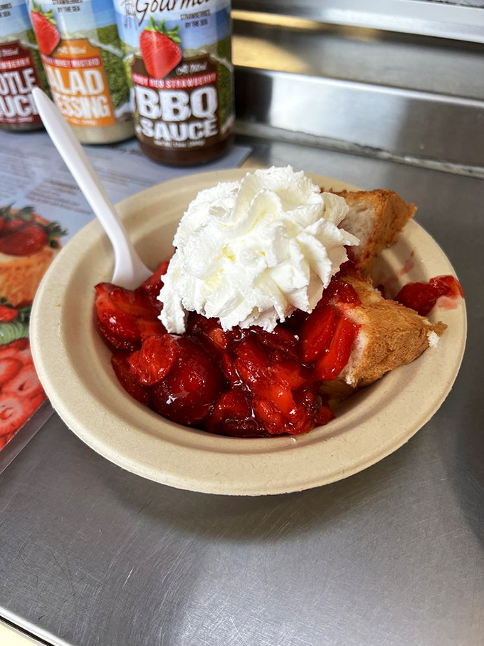 Behold the strawberry shortcake that launched a thousand road trips – generous berries drowning in real whipped cream perfection.