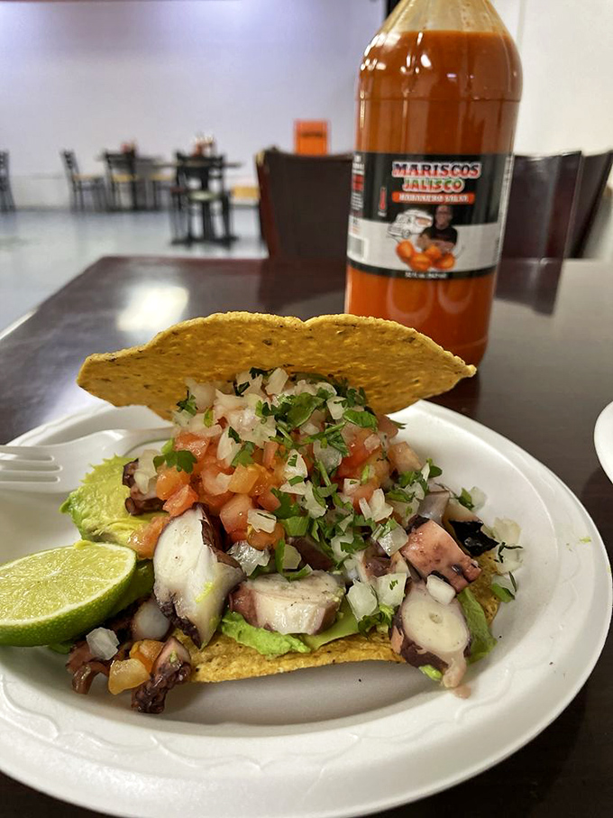 Ocean meets land in this spectacular tostada. Fresh seafood mingles with crisp vegetables atop a crunchy tortilla&mdash;a flavor fiesta in every bite.