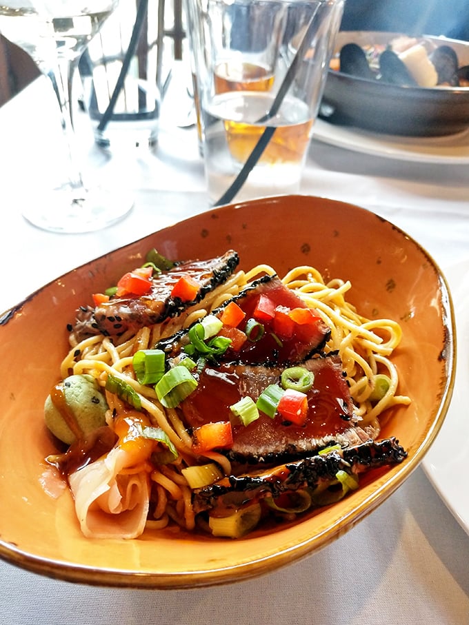 Twisted noodles that would make any Asian grandmother nod in approval. Perfectly seared beef rests atop a nest of umami-rich happiness.