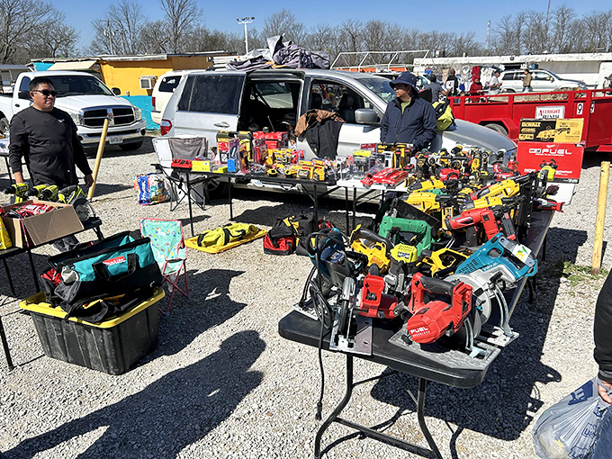 Tools of every trade imaginable spread across folding tables &ndash; a hardware store exploded and rearranged itself by some cosmic yard sale logic.