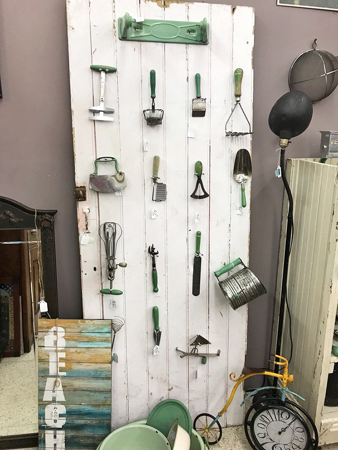 Someone's grandmother is missing her kitchen tools! This clever display turns vintage utensils into wall art, proving everything old becomes cool again eventually.