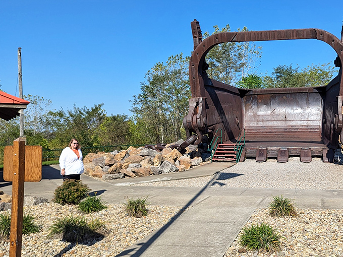 Size matters! The bucket provides perfect scale to show just how enormous this industrial relic truly is.