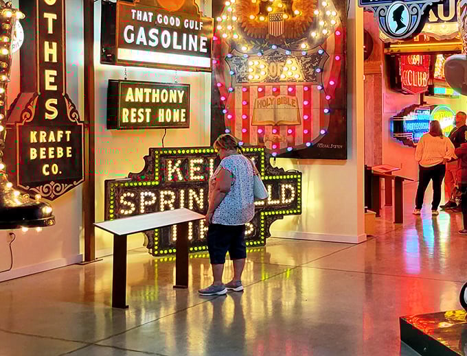 Illuminated history lessons never looked so good. Visitors bask in the warm glow of mid-century advertising that once beckoned hungry travelers across America.