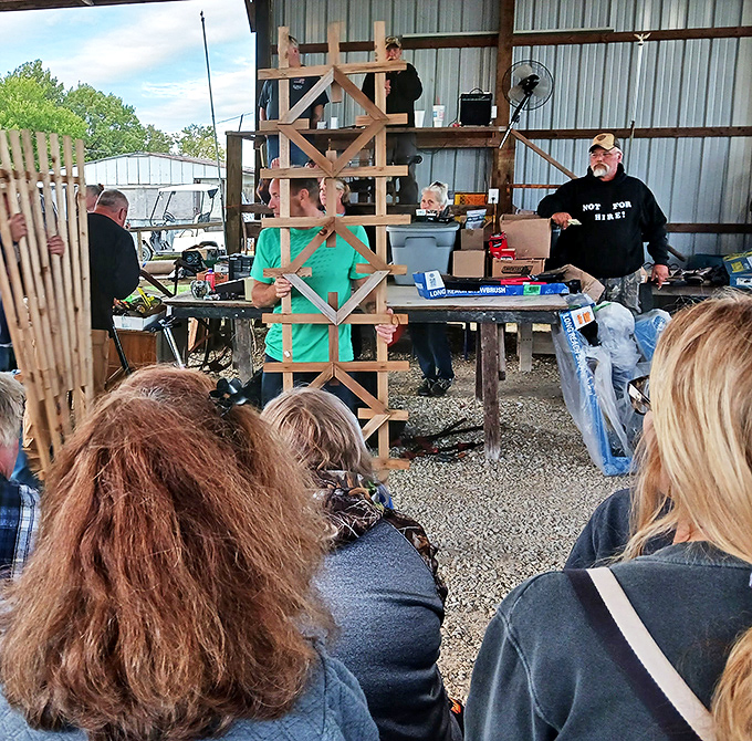 The auction draws a crowd of seasoned bidders. Like poker players, they hide their excitement behind stoic faces as treasures parade by.