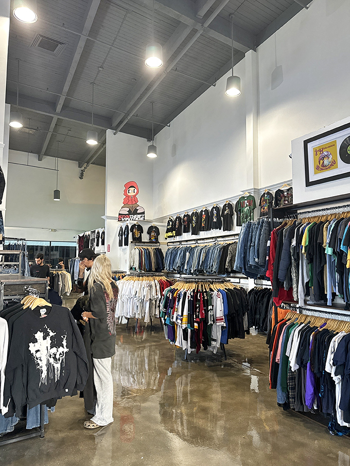 Shoppers browse meticulously organized racks where every item has been curated with an eye for quality and style.