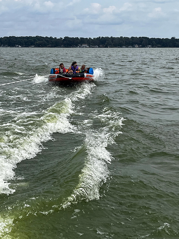 Who needs expensive theme park rides when you've got a tube, a boat, and Ohio's version of the high seas? Pure, unfiltered joy.