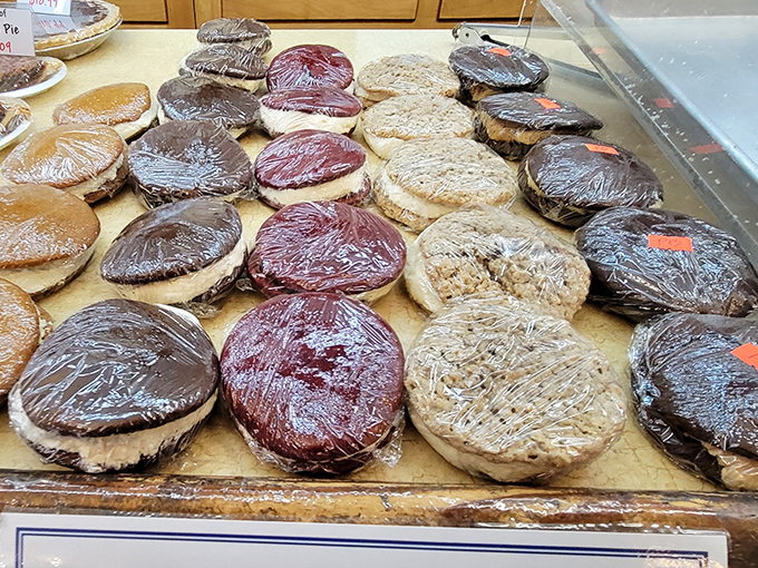 Whoopie pies lined up like edible hockey pucks of joy. These cake-and-cream sandwiches are the dessert equivalent of a warm Pennsylvania hug.