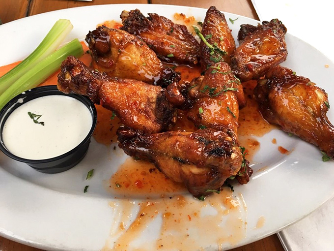 Wings so perfectly glazed they could make angels weep. The celery is just there to make you feel virtuous.