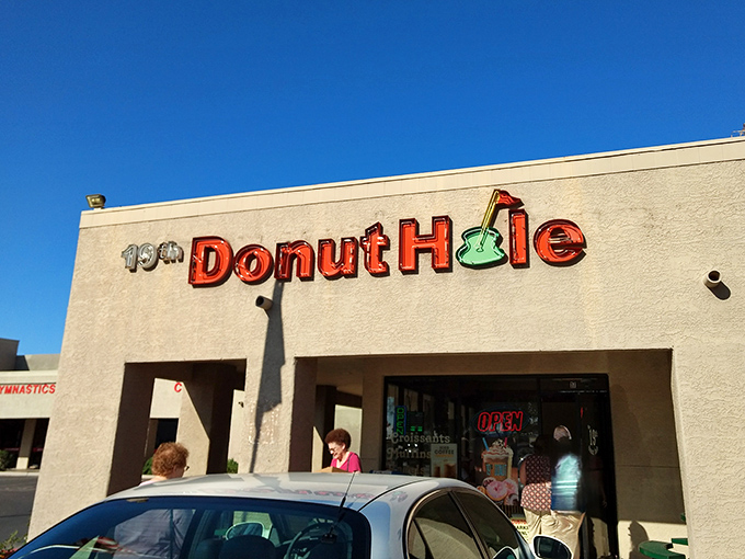 19th Donut Hole's golf-themed sign promises a hole-in-one for your taste buds, no green jacket required.