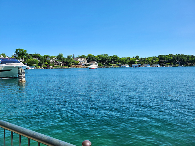 Charlevoix's waterfront beckons with blue waters and boats bobbing gently &ndash; pure Michigan magic captured in one frame.