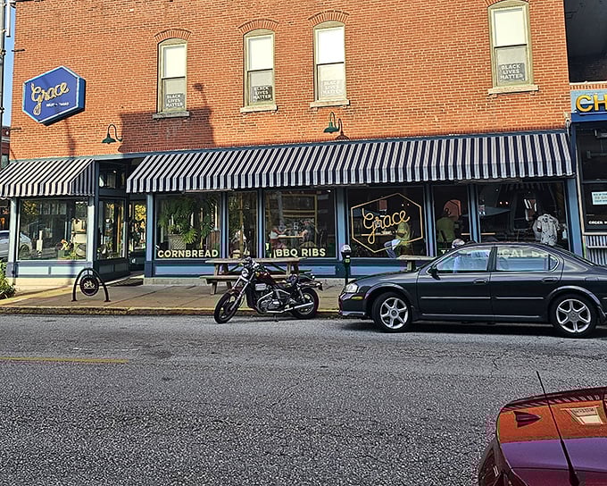 Grace's classic striped awning and brick facade bring a touch of urban charm to their soul-satisfying Southern comfort food.