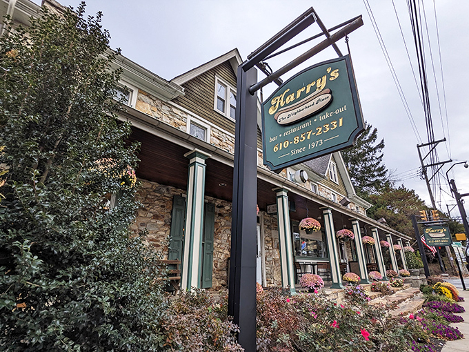 Harry's stone facade and hanging sign don't just say "restaurant" &ndash; they whisper "come inside, we've been perfecting hot dogs while others were still figuring out fire."