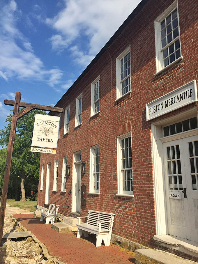 J. Huston Tavern's historic brick facade has witnessed centuries of hungry travelers. The steaks keep them coming back across generations.