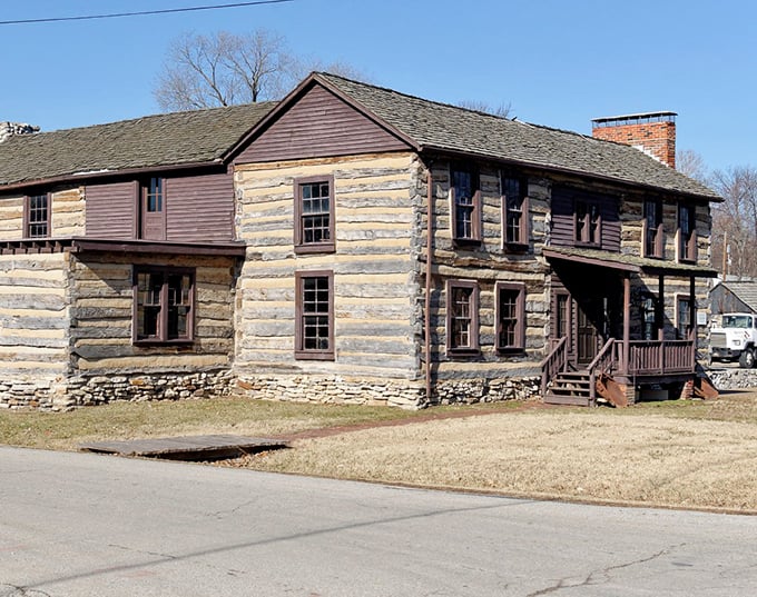 This historic log cabin stands as a testament to pioneer craftsmanship. Imagine the stories these hand-hewn logs could tell!