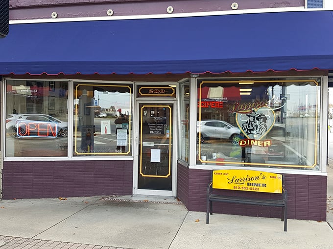 Larrison's purple storefront stands out in small-town Seymour like a friendly wink, promising diner magic within those humble walls.