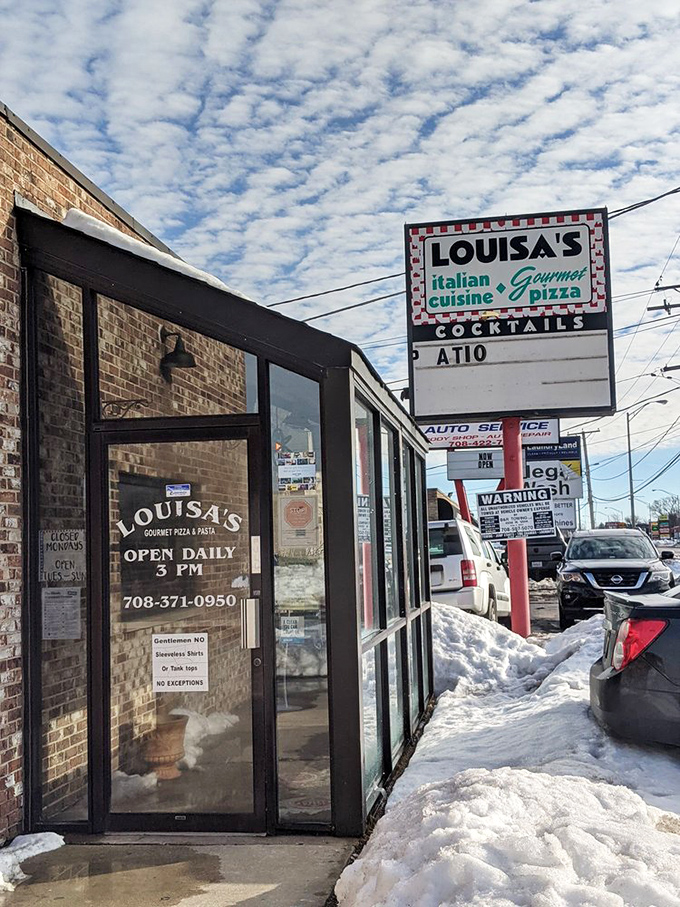 Louisa's sign stands proud against a winter sky, promising warm, cheesy comfort inside.