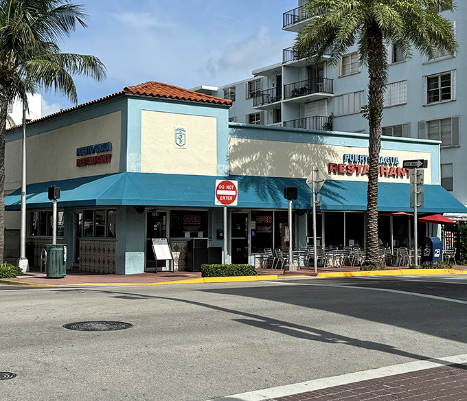 Puerto Sagua's blue awnings provide a splash of color and promise of authentic Cuban flavors on busy Collins Avenue.