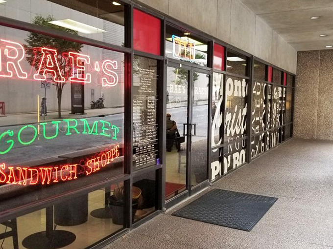 Rae's neon window sign glows like a lighthouse, guiding hungry souls toward sandwich perfection in a sea of mediocre lunch options.