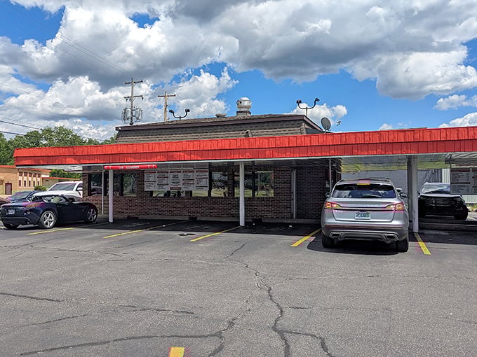 Rudy's red roof creates the perfect outdoor dining room where cars become your personal restaurant booth.