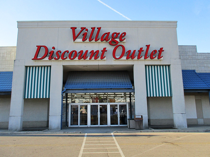 Village Discount Outlet's bold red lettering promises adventures in affordability. Step inside and let the bargain safari begin!