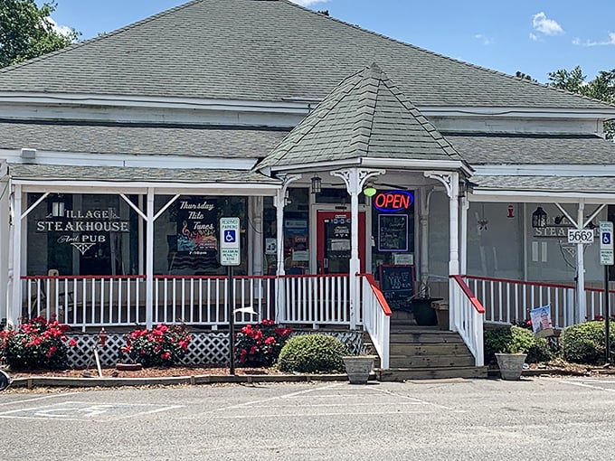 The Village Steakhouse looks like Grandma's house&mdash;if Grandma were secretly a steak wizard hiding behind white picket charm.