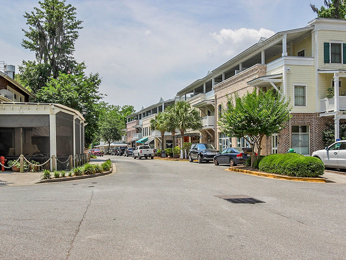 "Brick and white columns create Bluffton's signature Southern charm. Those balconies have probably hosted more sweet tea conversations than anyone can count."