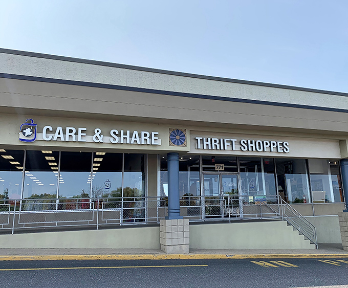 The Care & Share sign glows against a perfect blue Pennsylvania sky. Those glass windows offer tempting glimpses of the bargains within.