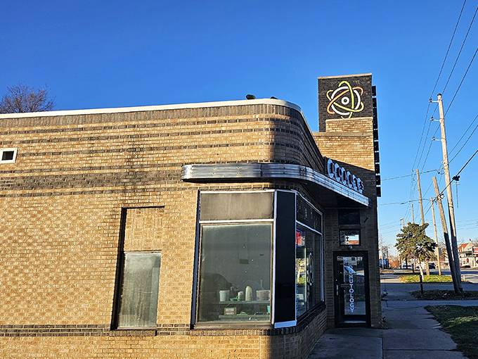 Mid-century modern meets donut innovation. This curved brick building houses some seriously scientific approaches to breakfast indulgence.