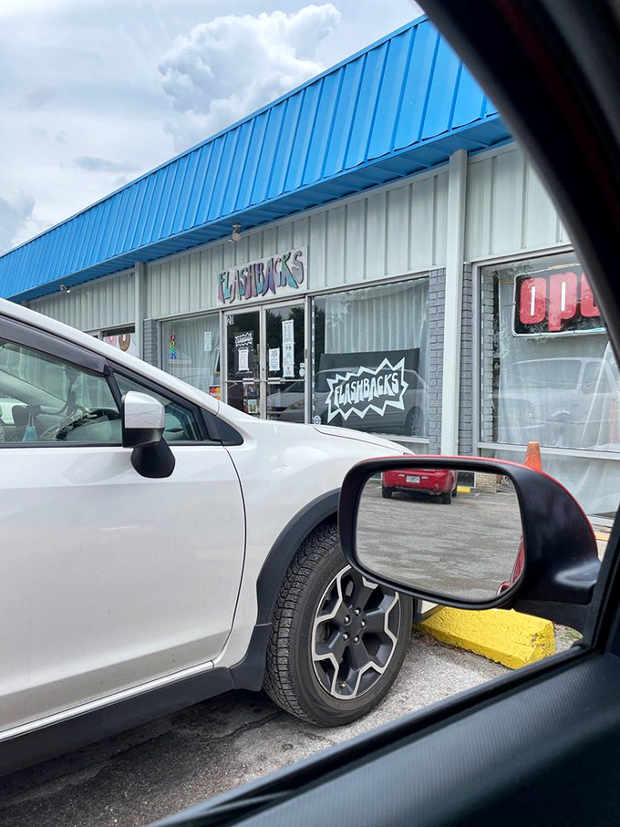 That bright blue awning signals fashion salvation ahead. Where yesterday's trends become tomorrow's statement pieces!