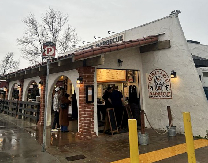 Heritage's brick patio whispers "stay awhile" while the smokers out back promise pure meat magic. 