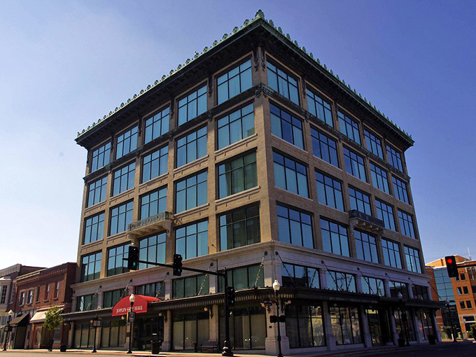 Modern glass and steel rise like a phoenix, showing small-town determination at work.