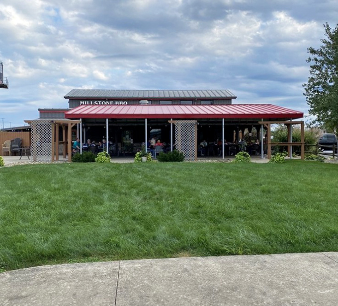 The lush green lawn outside Millstone is nature's perfect waiting room before you dive into smoky, meaty heaven.