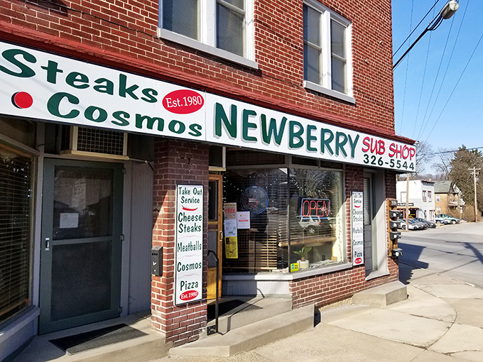 The simple "OPEN" sign in the window is your invitation to cheesesteak paradise &ndash; no fancy frills, just fantastic food.
