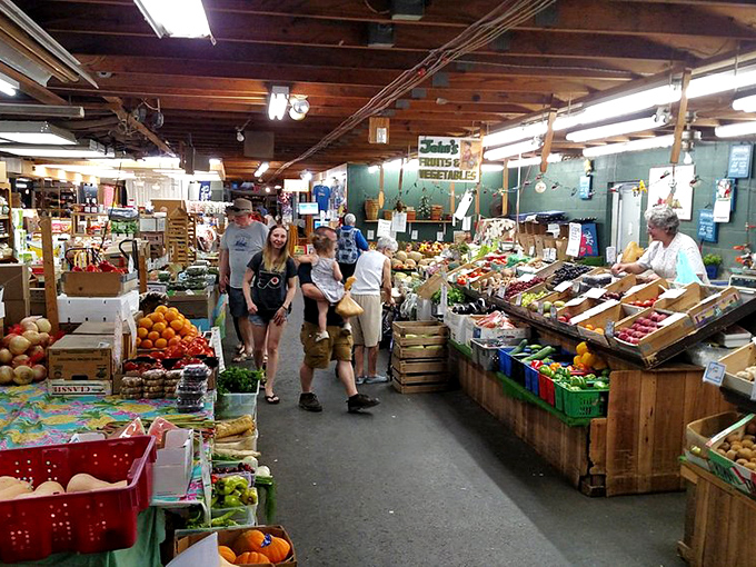 Rows of handbags dangle like ripe fruit, ready to be plucked by shoppers with an eye for fashion bargains at Renninger's.