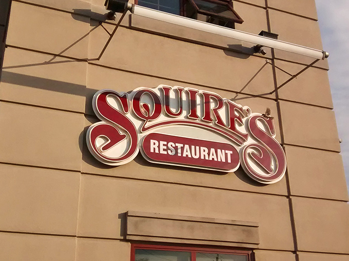 The bold red Squire's sign announces itself with confidence. No need for flashy gimmicks when your pizza speaks for itself.