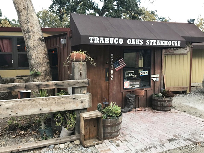 Where flower barrels meet flame-grilled perfection. Trabuco Oaks' charming exterior hints at the warm, welcoming experience waiting inside.