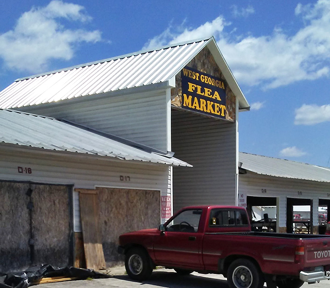 Morning light catches West Georgia Flea Market's sign, beckoning early birds to catch the proverbial worm&mdash;or vintage fishing lure!