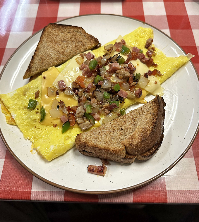 This Western omelet doesn't just contain ham and peppers&mdash;it celebrates them. Paired with perfectly browned toast, it's breakfast architecture at its finest.