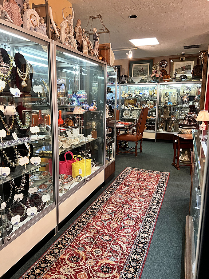 A collector's fever dream&mdash;display cases brimming with jewelry, figurines, and curiosities. That oriental runner isn't just a rug; it's a textile roadmap to the past.