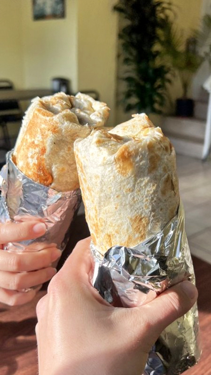Behold the burrito battalion! Wrapped in foil armor, these handheld happiness cylinders are ready for their delicious duty.